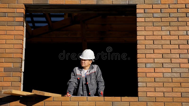 Man In Window Of Building House Stock Image - Image of builder ...
