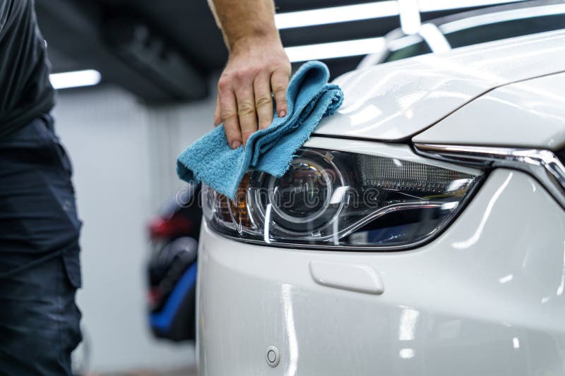 Man wipes a car with a rag stock image. Image of cloth - 282008865
