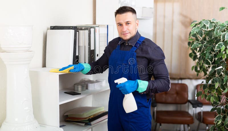 Man Wipes Dust from Table in Modern Office Stock Photo - Image of work ...