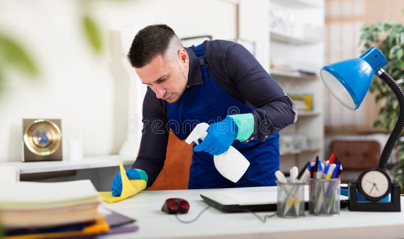 Man Wipes Dust from Table in Modern Office Stock Photo - Image of ...