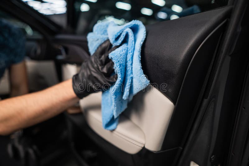 A Man Wipes the Surface of the Car Interior with a Microfiber Cloth ...