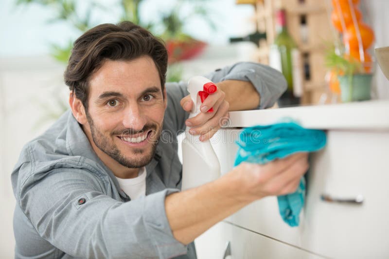 Man Wiping Down Kitchen Cupboard Stock Photo - Image of people, clean ...