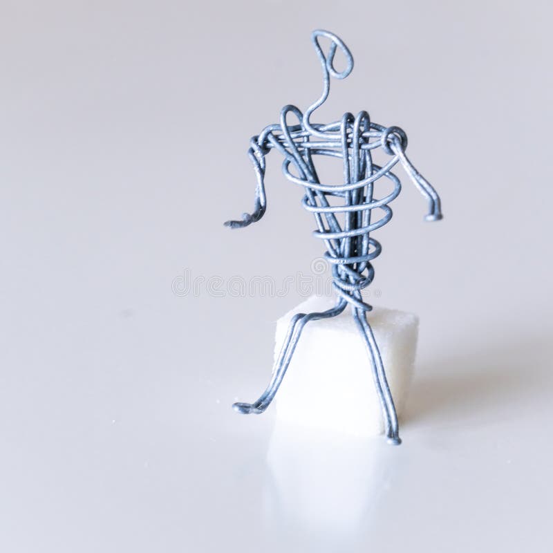 A Man of Wire Sits in the Pose of a Thinker, Raising His Hand To His ...