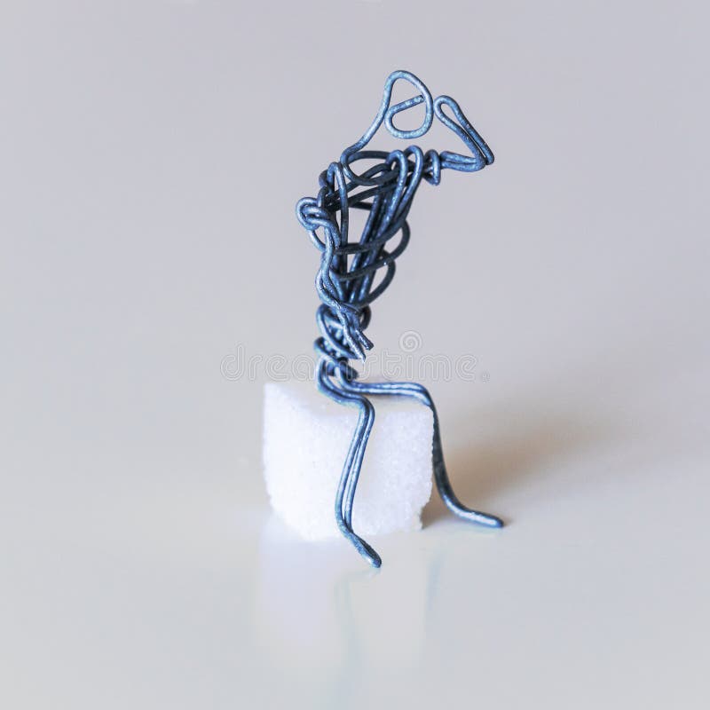 A Man of Wire Sits in the Pose of a Thinker, Raising His Hand To His ...