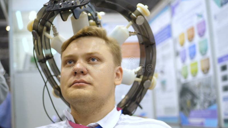 Man Wired To an EEG Machine or Electroencephalograph Which Produces a ...