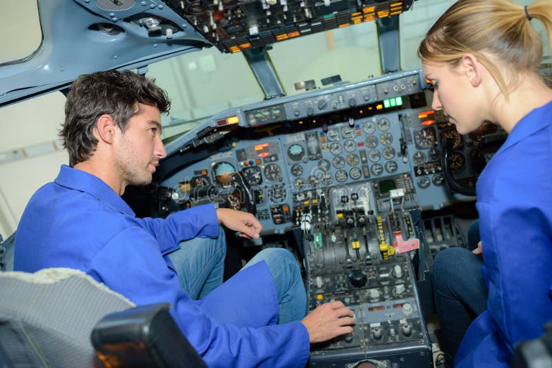 Man and Woman in Aircraft Cockpit Stock Image - Image of pilot, panel ...