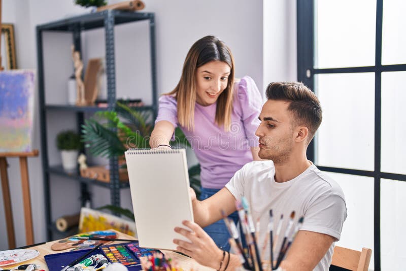 Man and Woman Artists Couple Drawing on Notebook at Art Studio Stock ...