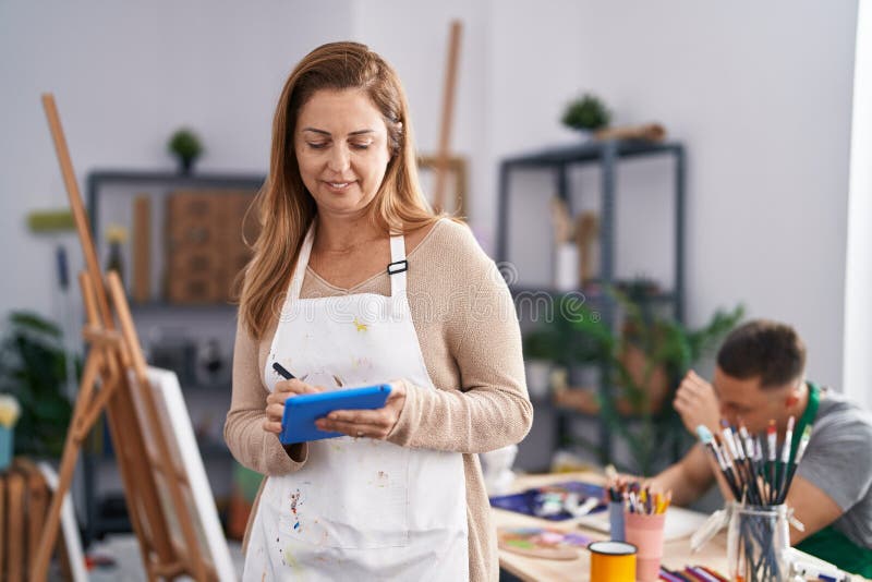 Man and Woman Artists Drawing on Notebook Using Touchpad at Art Studio ...