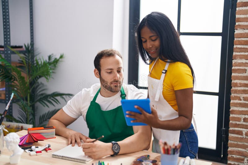 Man and Woman Artists Drawing on Notebook Using Touchpad at Art Studio ...