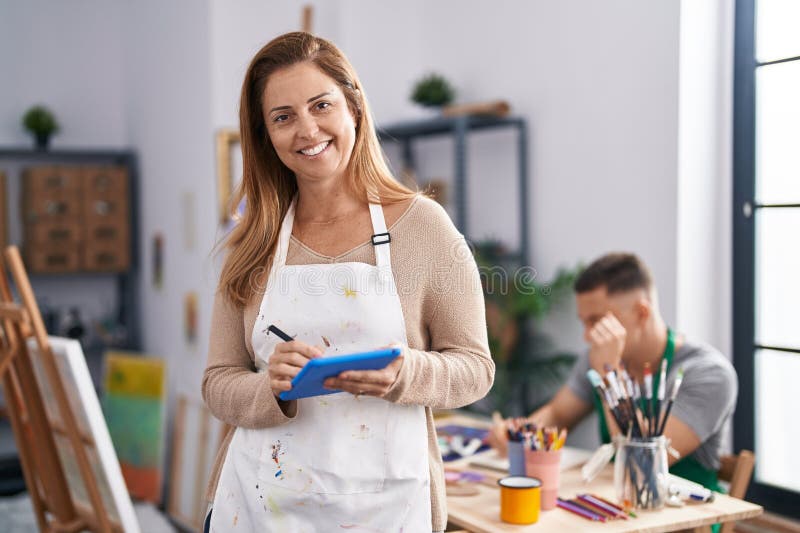 Man and Woman Artists Drawing on Notebook Using Touchpad at Art Studio ...