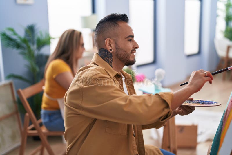 Man and Woman Artists Smiling Confident Drawing at Art Studio Stock ...