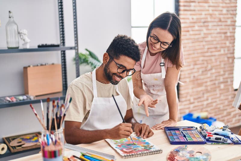 Man and Woman Artists Smiling Confident Drawing on Notebook at Art ...