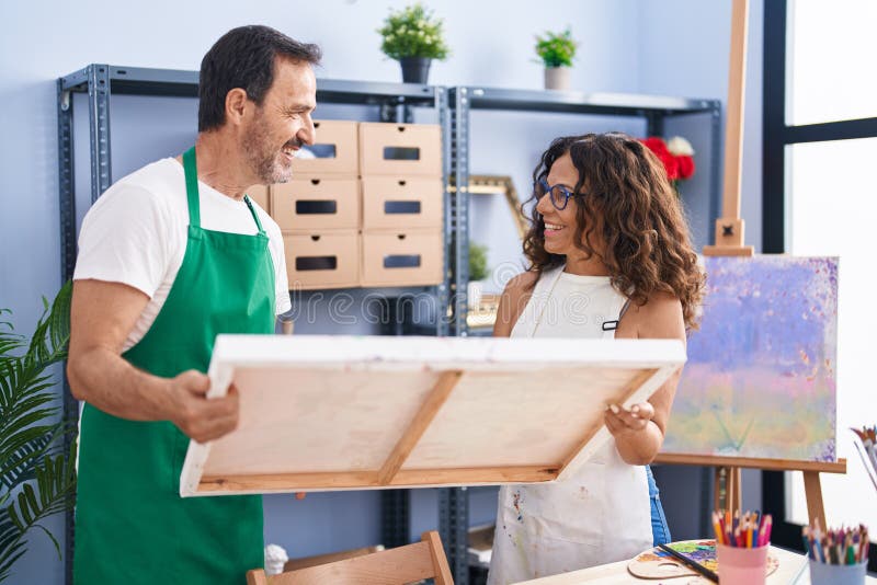 Man and Woman Artists Smiling Confident Looking Draw at Art Studio ...