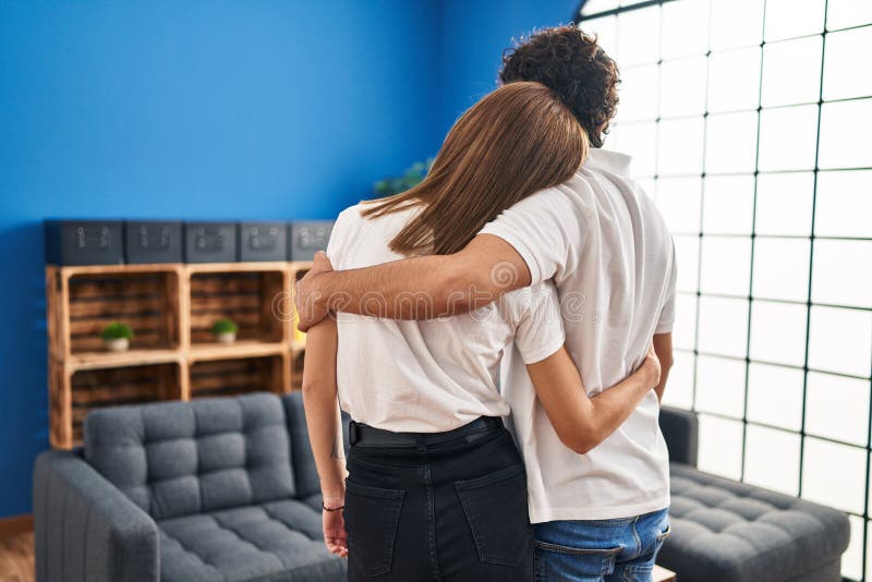 Man and Woman on Back View Hugging Each Other at Home Stock Photo ...