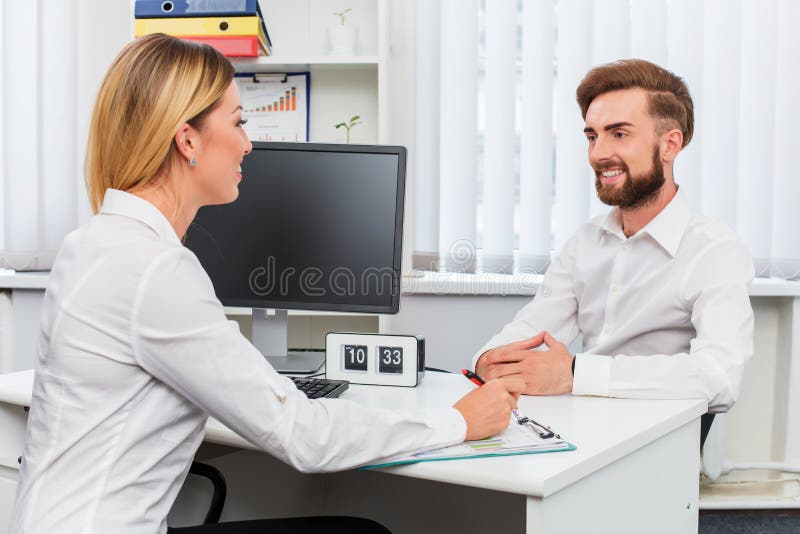Man and a Woman Being Interviewed in the Office Stock Image - Image of ...