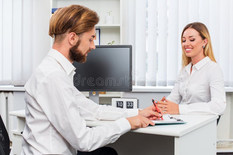 Man and a Woman Being Interviewed in the Office Stock Photo - Image of ...