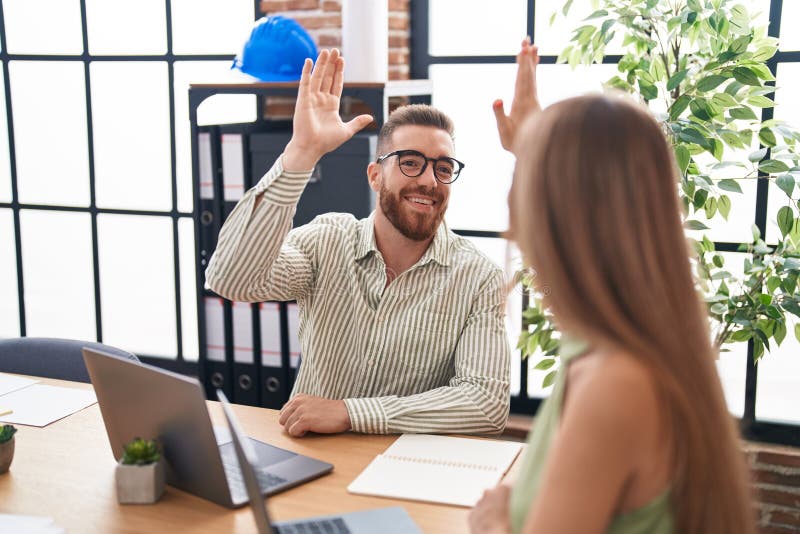Man and Woman Business Workers High Five with Hands Raised Up at Office ...