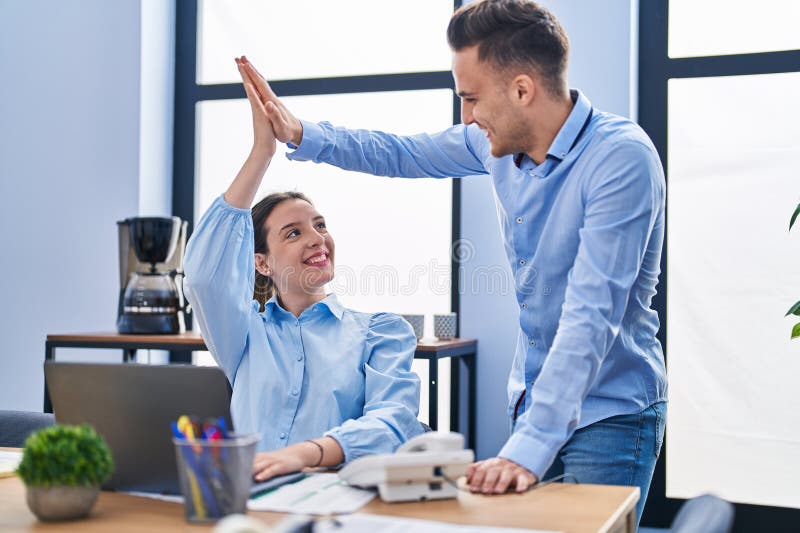 Man and Woman Business Workers High Five with Hands Raised Up at Office ...