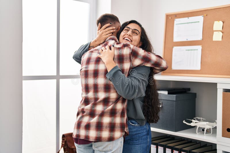 Man and Woman Business Workers Hugging Each Other at Office Stock Photo ...