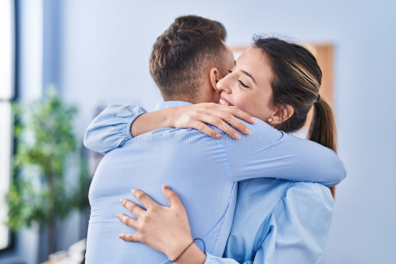 Man and Woman Business Workers Hugging Each Other at Office Stock Photo ...