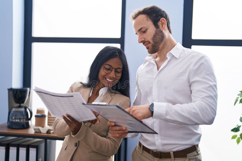 Man and Woman Business Workers Reading Document Standing Together at ...