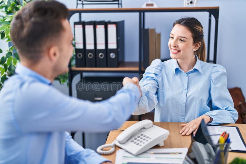 Man and Woman Business Workers Shake Hands Working at Office Stock ...