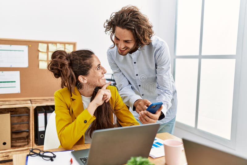 Man and Woman Business Workers Smiling Confident Using Smartphone at ...