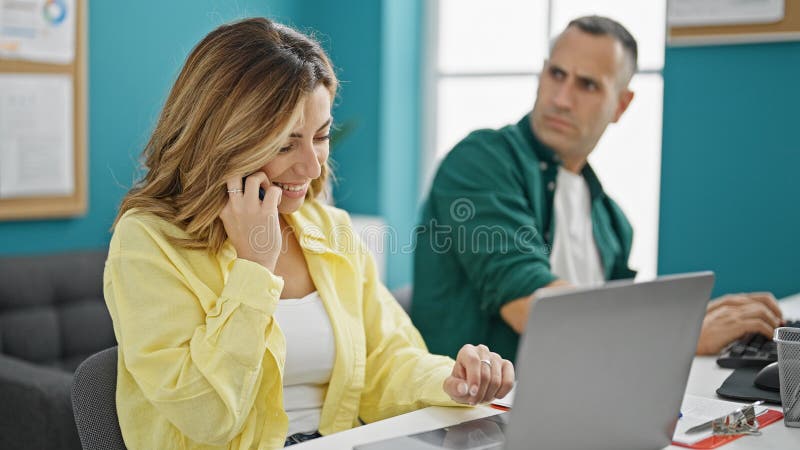 Man and Woman Business Workers Talking on Smartphone while Work at the ...