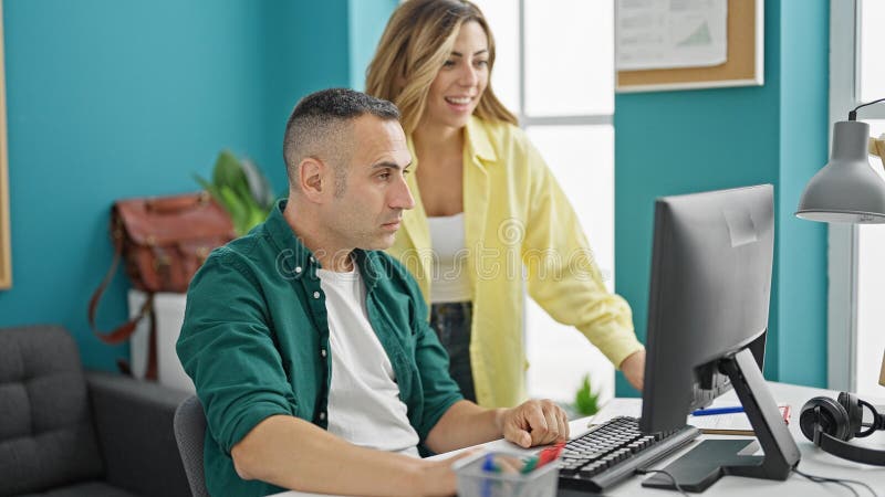 Man and Woman Business Workers Using Computer Smiling at the Office ...