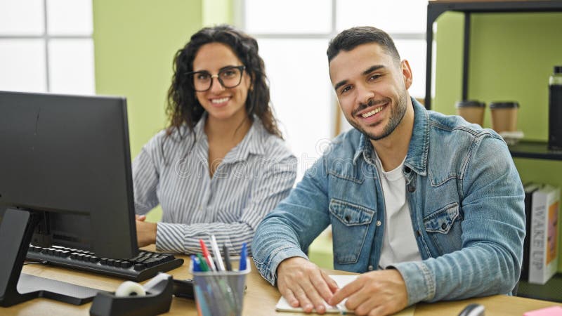 Man and Woman Business Workers Using Computer Taking Notes at the ...