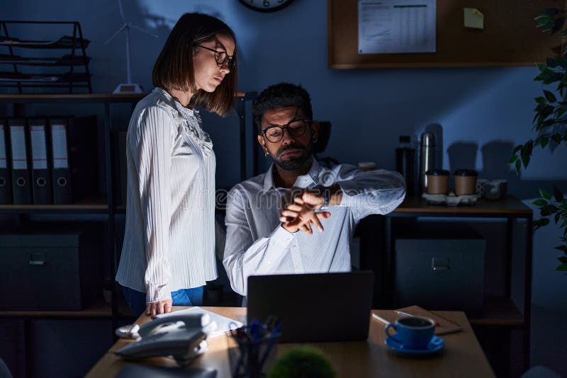 Man and Woman Business Workers Using Laptop Looking Watch at Office ...