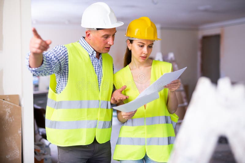 Man and Woman Builders Talking in House Stock Photo - Image of profession, blueprint: 400178498