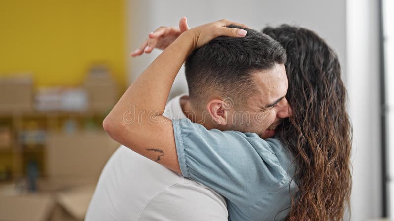 Man And Woman Couple Hugging Each Other Receiving House Key At New Home