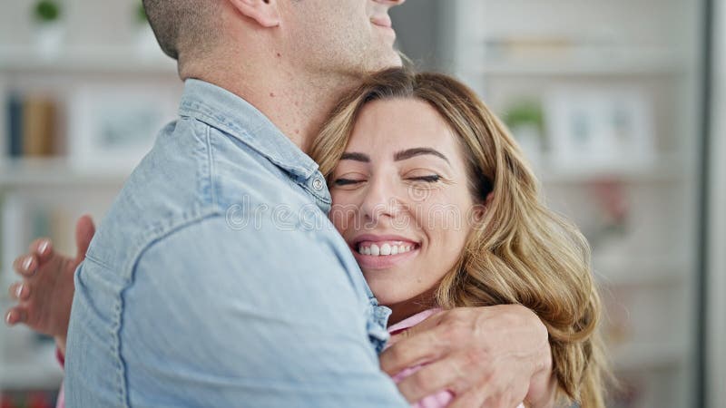 Man And Woman Couple Hugging Each Other Smiling At Home Stock Footage