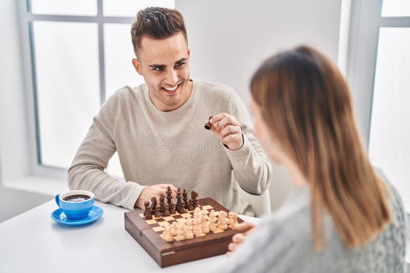 Man and Woman Couple Playing Chess Sitting on Table at Home Stock Image ...