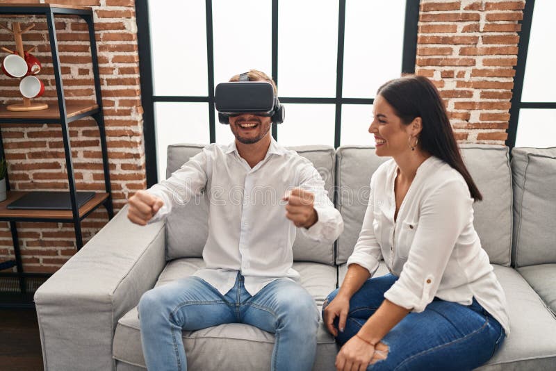 Man and Woman Couple Playing Video Game Using Vr Goggles at Home Stock ...