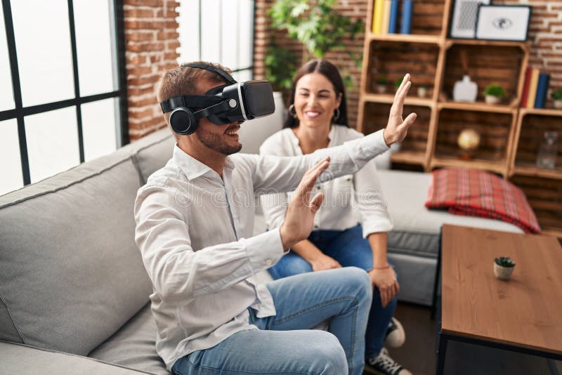 Man and Woman Couple Playing Video Game Using Vr Goggles at Home Stock ...