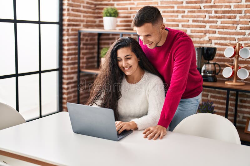 Man and Woman Couple Smiling Confident Using Laptop at Home Stock Photo ... Man and Woman Couple Smiling Confident Using Laptop at Home Stock Photo ...