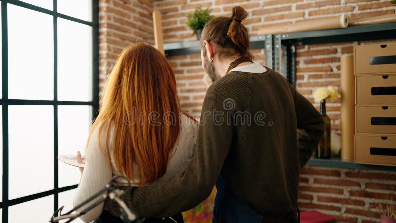 Man and Woman Couple Standing on Back View at Art Studio Stock Photo ...