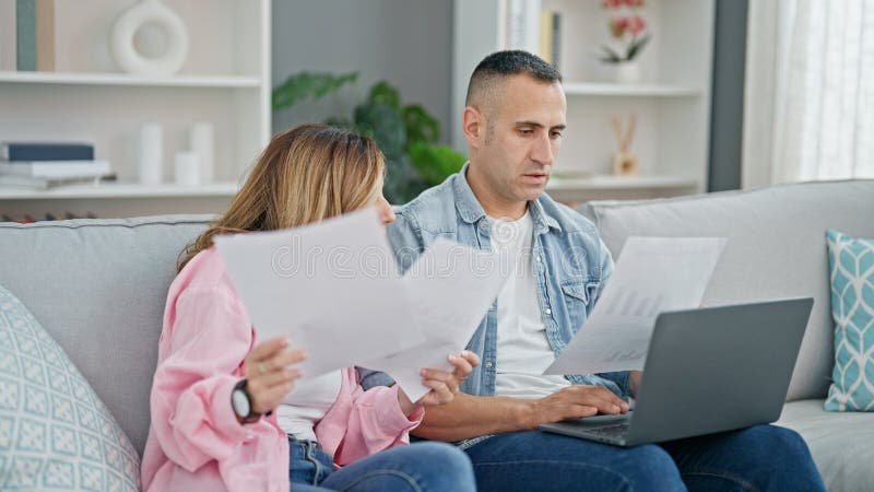 Man and Woman Couple Using Laptop Reading Document at Home Stock Image ...