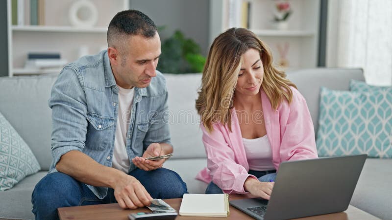 Man and Woman Couple Using Laptop and Taking Notes Counting Peruvian ...