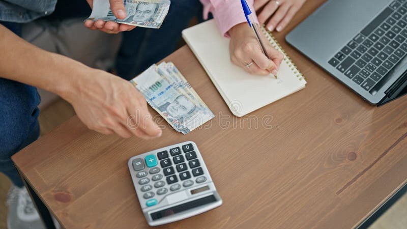 Man and Woman Couple Using Laptop and Taking Notes Counting Peruvian ...