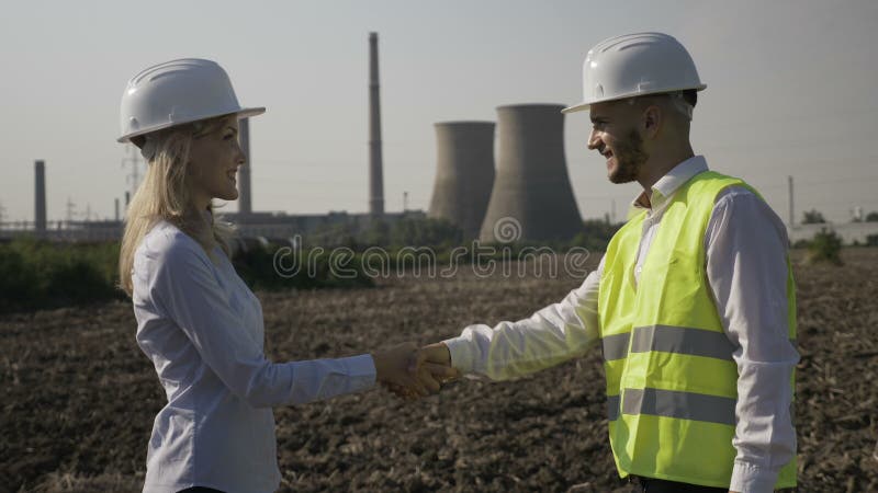 Man and Woman Developers Shaking Hands after a Successful Engineering ...