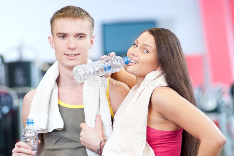 Man and Woman Drinking Water after Sports Stock Image - Image of ...