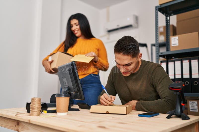 Man and Woman Ecommerce Business Workers Preparing Order Package at ...
