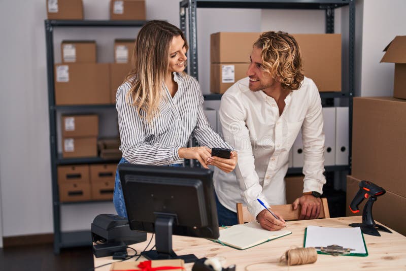 Man and Woman Ecommerce Business Workers Writing on Book Using ...