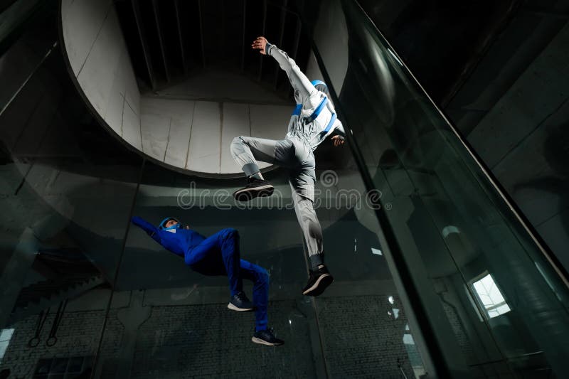 A Man and a Woman Enjoy Flying Together in a Wind Tunnel. Free Fall ...