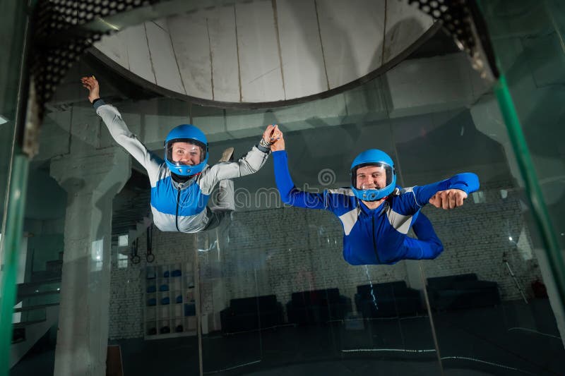 A Man and a Woman Enjoy Flying Together in a Wind Tunnel. Free Fall ...