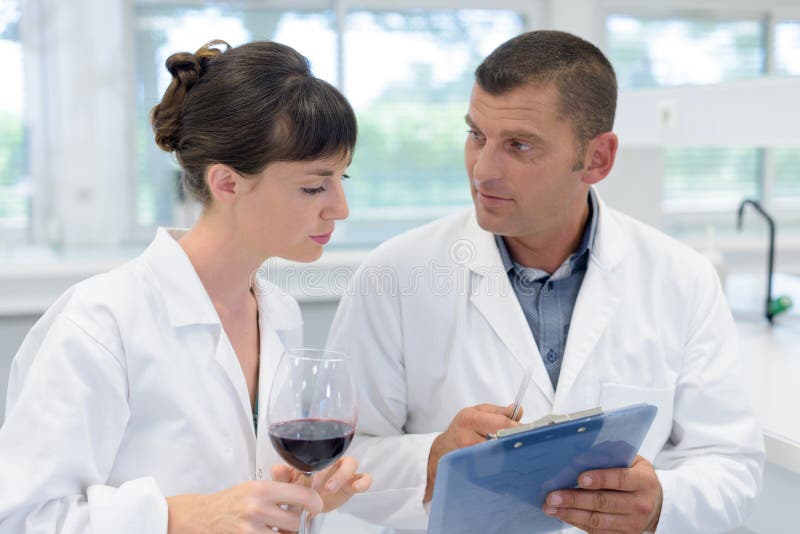 Man and Woman Experts in White Coats Checking Wine Quality Stock Image ...
