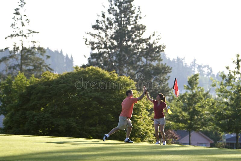 Man and Woman on Golf Course - Horizontal Stock Image - Image of ...